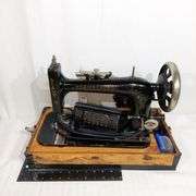 VINTAGE SEAMSTRESS SEWING MACHINE - Bentley & Associates, LLC