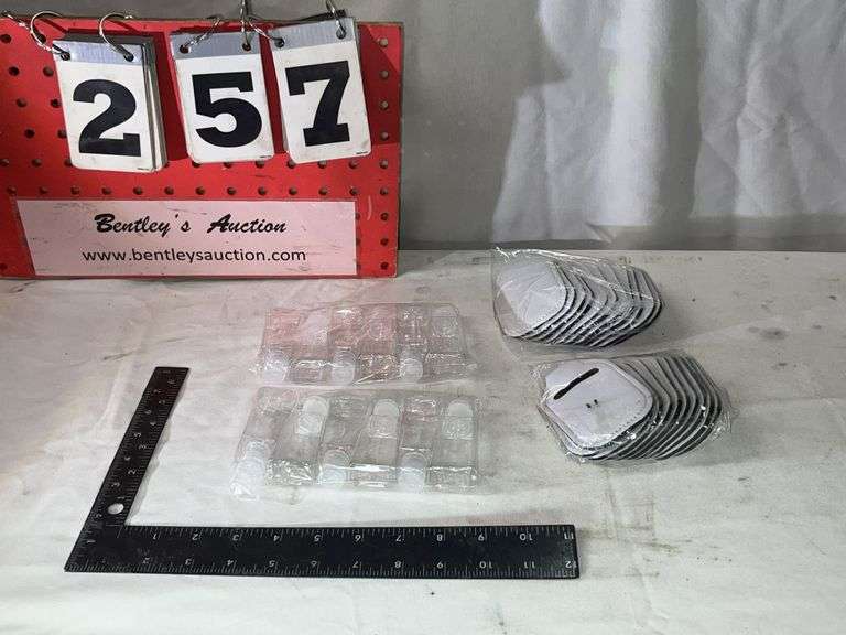 CONTAINER: KEY RINGS, BOTTLES - Bentley & Associates, LLC