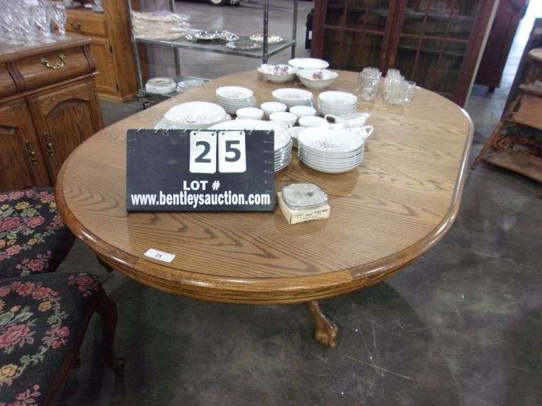 DARK STAINED OAK OVAL DINING TABLE, 70" X 48" - Bentley & Associates, LLC