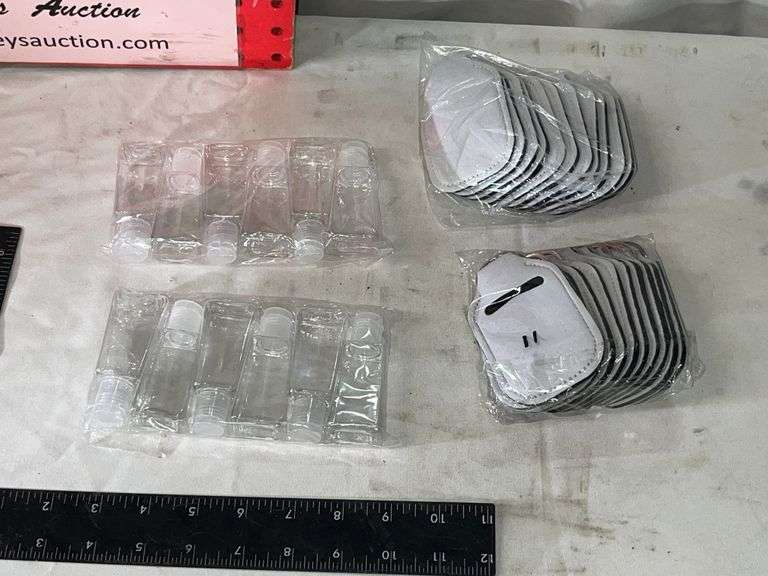 CONTAINER: KEY RINGS, BOTTLES - Bentley & Associates, LLC