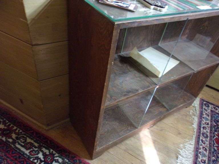 DARK BROWN WOODEN CUBBY W/ GLASS PANELS - Bentley & Associates, LLC