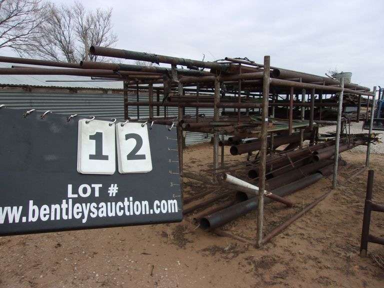 18' PIPE RACK W/ CONTENTS: T-POST, PIPE, 1/2" X 2" X 5' STEEL STRAPPING ...