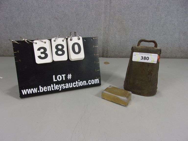 LOT: COWBELL & GOLD PAINTED LEAD BLOCK - Bentley & Associates, LLC