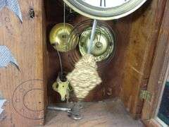 WOOD FRAMED FREE STANDING CLOCK - Bentley & Associates, LLC