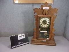 WOOD FRAMED FREE STANDING CLOCK - Bentley & Associates, LLC