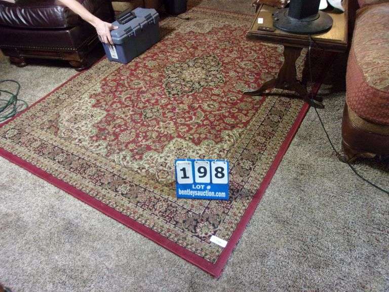 RED AND TAN DALTORIO AREA RUG - 5'3" X 7'6" ****LOCATED AT APARTMENT ...