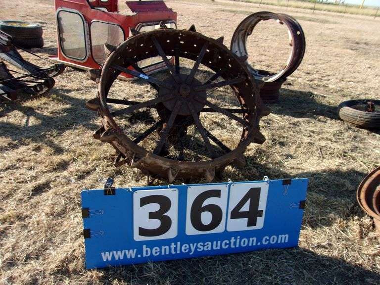 8-SPOKE VINTAGE STEEL TRACTOR WHEEL - Bentley & Associates, LLC
