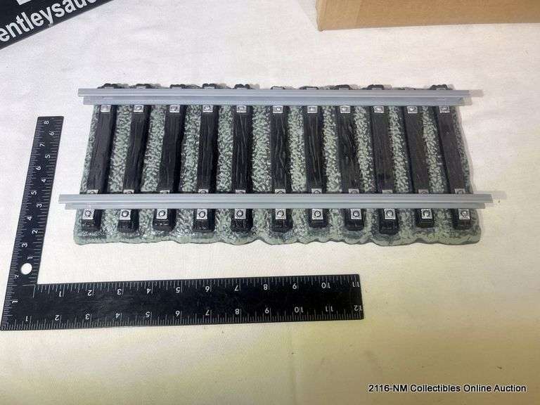 BOX: 4 SECTIONS OF PLASTIC TRACKS - Bentley & Associates, LLC