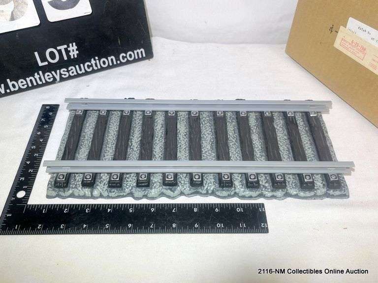 BOX: 4 SECTIONS OF PLASTIC TRACKS - Bentley & Associates, LLC