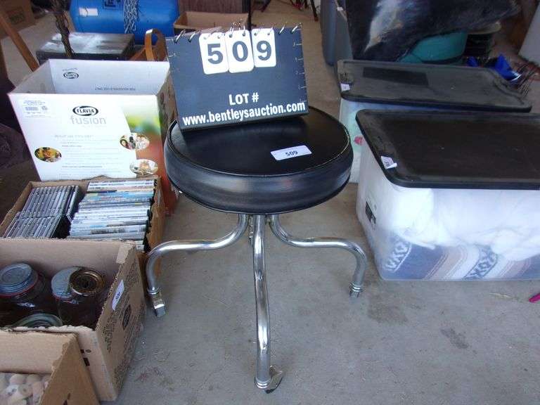 ROLLING METAL STOOL, BLACK LEATHER SEAT - Bentley & Associates, LLC
