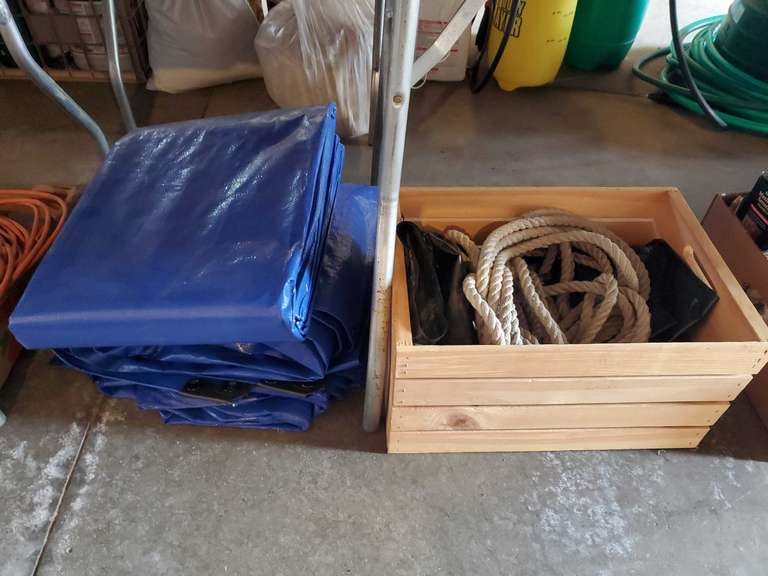 Wooden crate with rope and assorted blue tarps - Bid-Assets Online Auctions