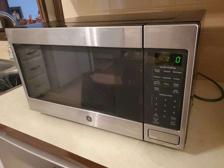 ***REMOVED FROM AUCTION***GE stainless 1150 watts microwave oven with ...