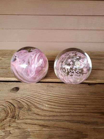 Two large pink swirl glass marbles - Bid-Assets Online Auctions