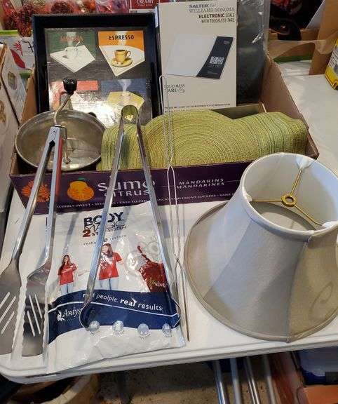 Household items including muted green lamp shade, barbecue tools ...