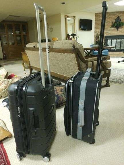 Samsonite hard shell four-wheel carry-on with retractable handle and ...