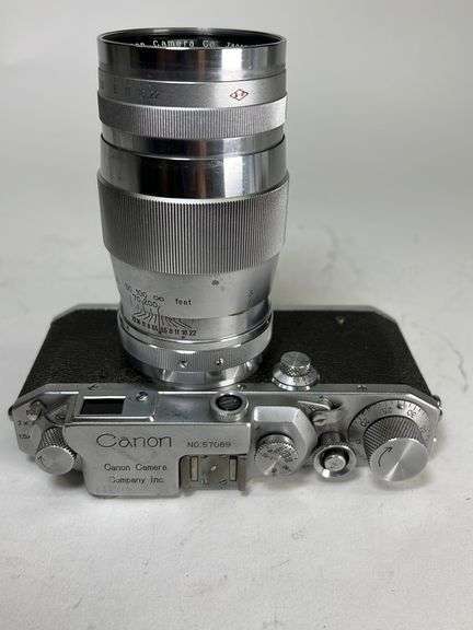 Canon 35 mm camera and telephoto lens - Bid-Assets Online Auctions