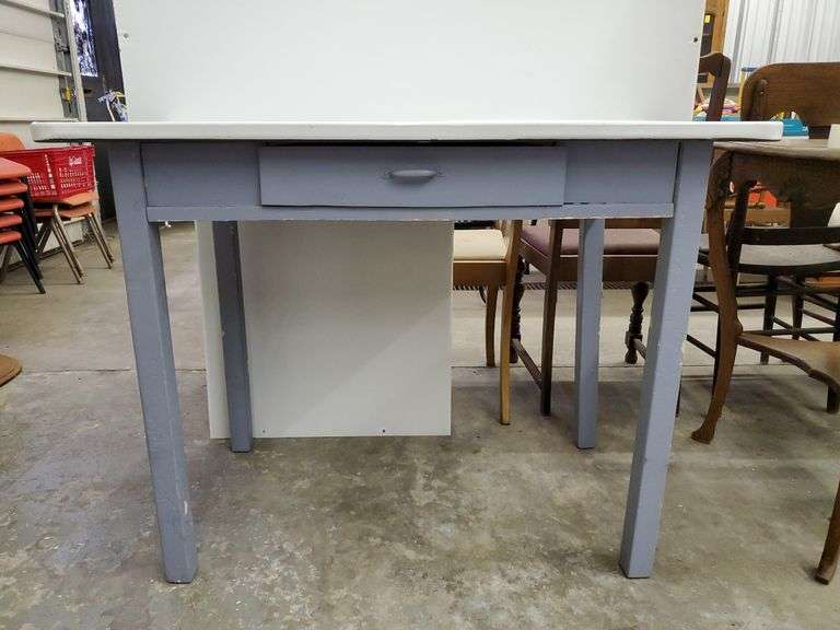 Porcelain top table with center drawer. Measures 41w x 25d x 30h. - Bid ...