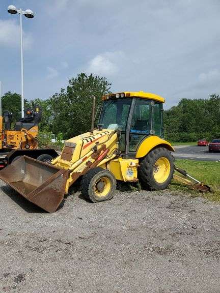 2004 New Holland LB90.B backhoe, Serial #31051147, 4WD, extend-a-hoe ...
