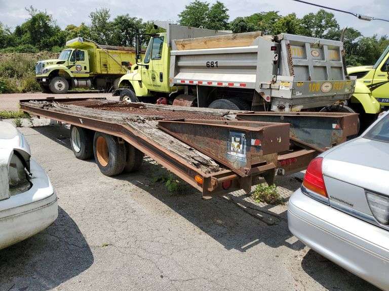 Trail King tandem axle trailer with beavertail and attached folding ...