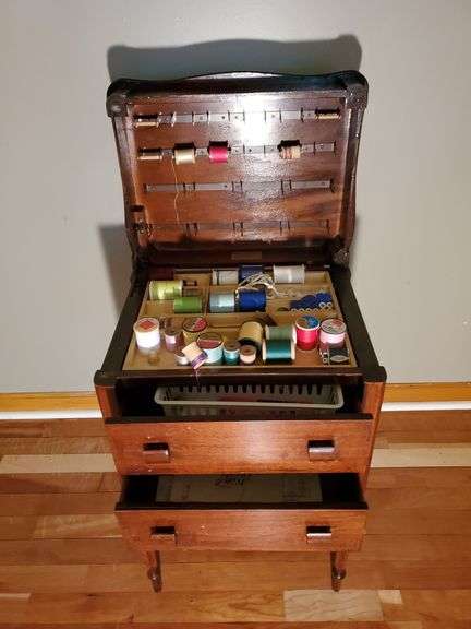 Solid wood sewing cabinet with lift top and two drawers measures 26 in ...