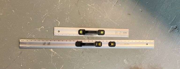 Two leveling rulers with handles - Bartlett Auctions Inc.