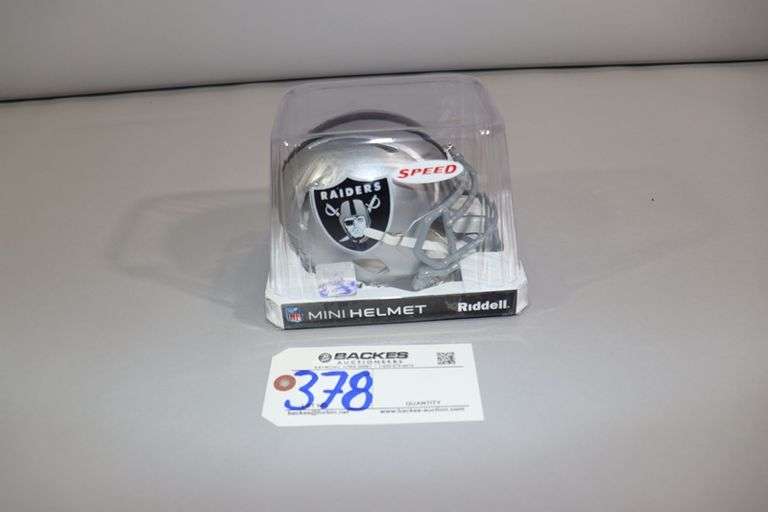 Raiders mini helmet - Backes Commercial Auctioneers