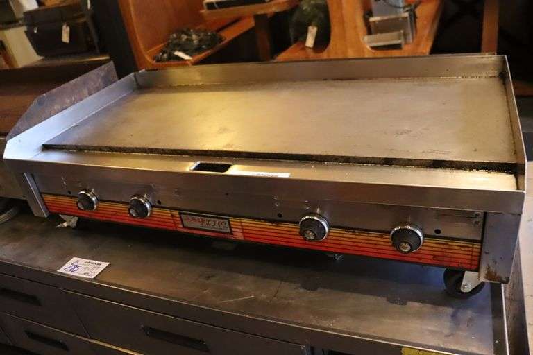Eagle Red Hot 48" gas flat grill - has caster on bottom of grill ...