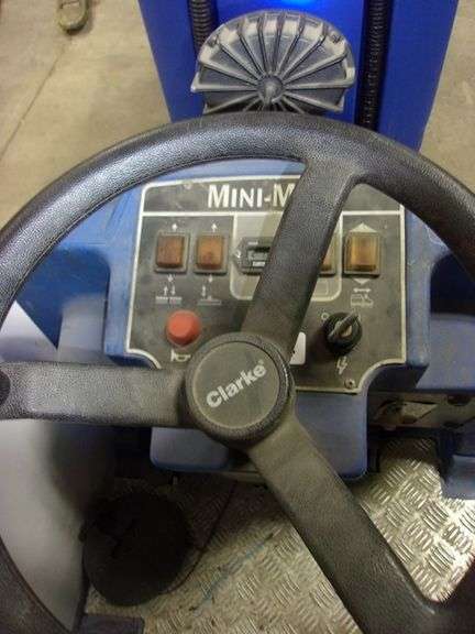 Clark Boost Ride on scrubber, new batteries - Backes Commercial Auctioneers