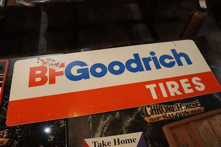 1989 BF Goodrich porcelain 17" x 48" sign - Backes Commercial Auctioneers