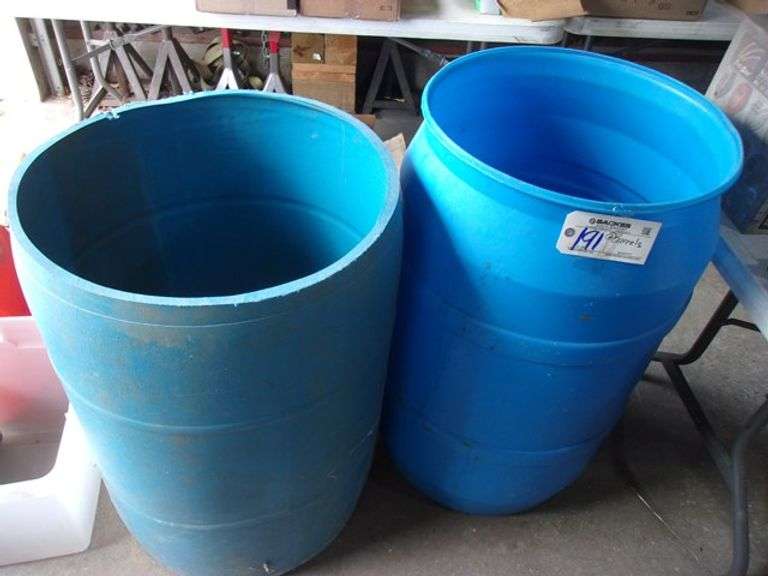 Pair of barrels, one with holes in bottom - Backes Commercial Auctioneers