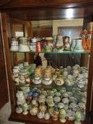 Large salt and pepper collection in wall cabinet 22" x 28", included ...