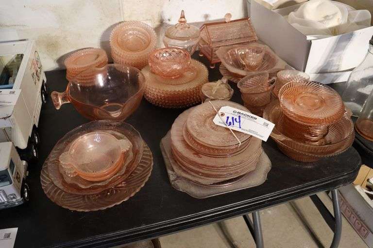 All to go - pink depression glass on table - Backes Commercial Auctioneers