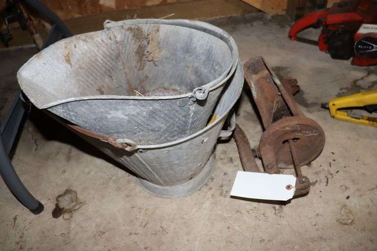 All to go - ash buckets and well pump top - Backes Commercial Auctioneers