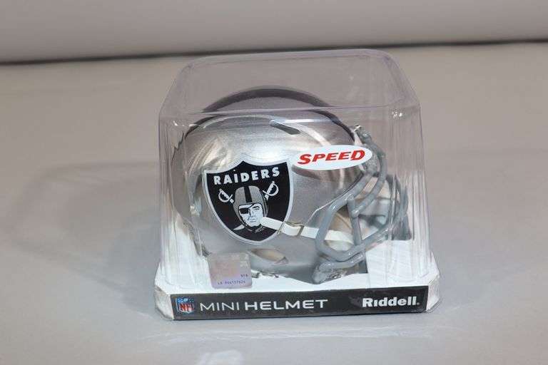 Raiders mini helmet - Backes Commercial Auctioneers