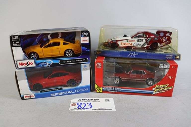 All to go - 4 die cast cars in boxes - 2) Maisto 1/24 scale 2006 & 2105 ...