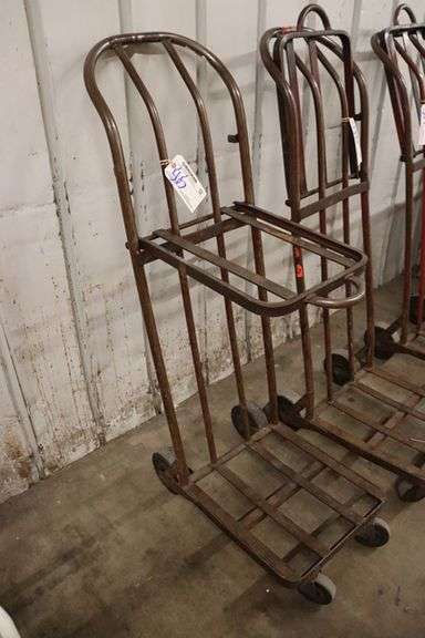 Red portable 4 wheel stocking cart - Backes Commercial Auctioneers
