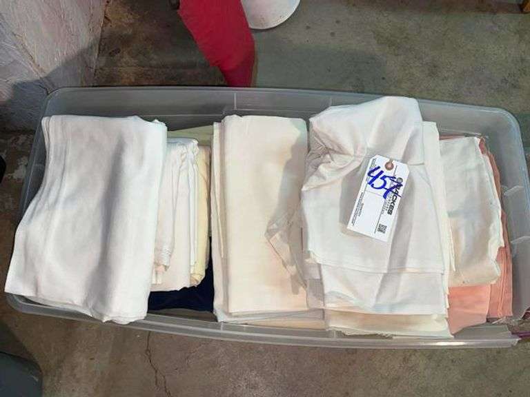 Tote of assorted linens - Backes Commercial Auctioneers