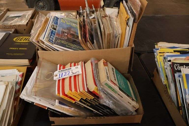 All to go - 2 assorted boxes of farm manuals and Ford literature ...