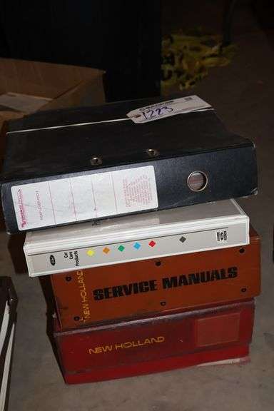 All to go - stack of manuals and catalogs - Backes Commercial Auctioneers