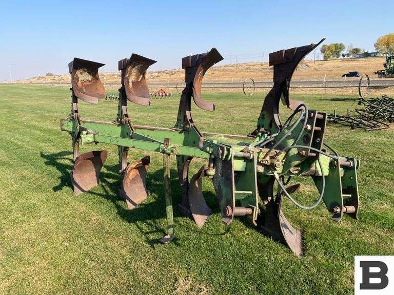 John Deere 8450 4 Bottom Rollover Plow - Booker Auction Company