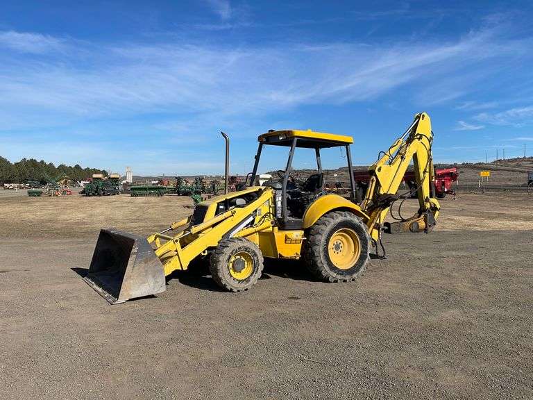New Holland 575E Backhoe - Booker Auction Company