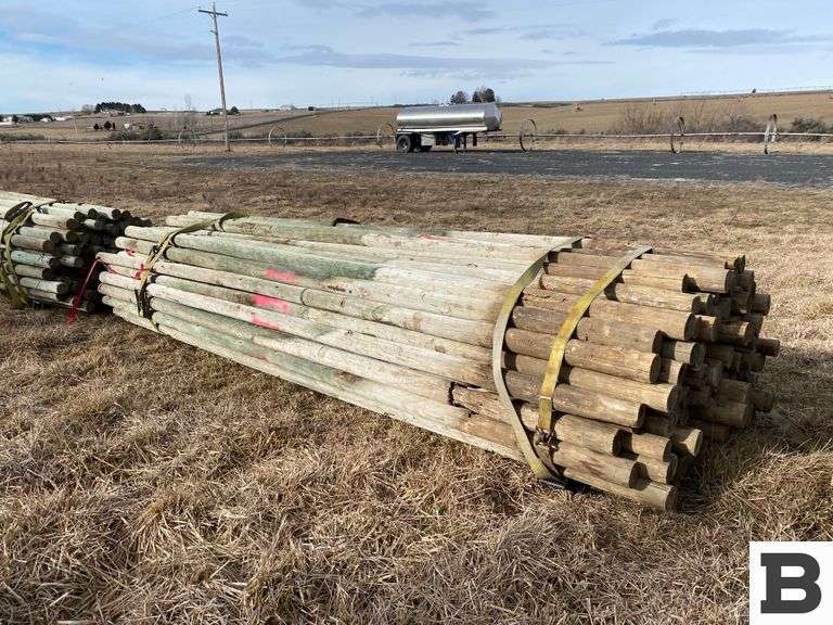 14' Treated Posts - Booker Auction Company