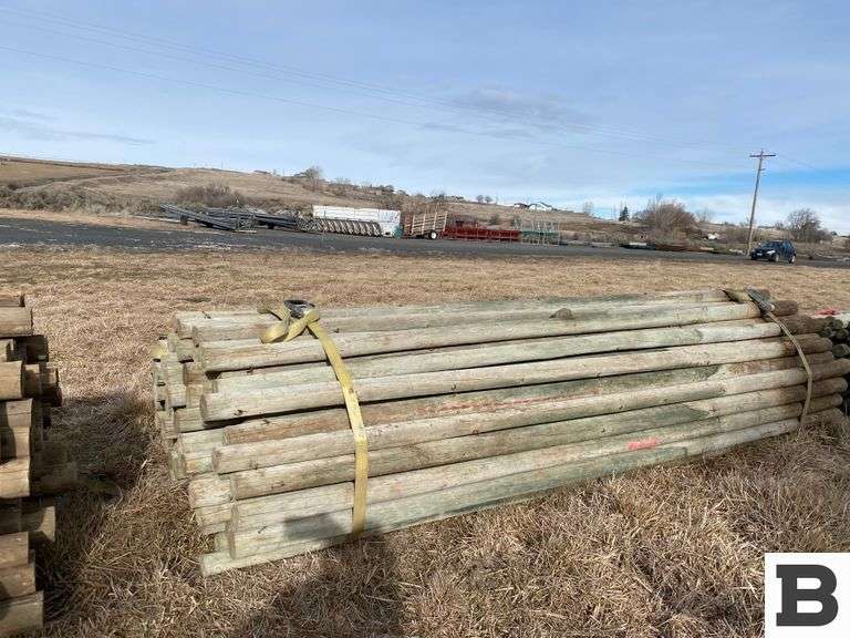 14' Treated Posts - Booker Auction Company