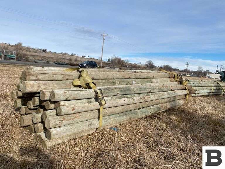 14' Treated Posts - Booker Auction Company