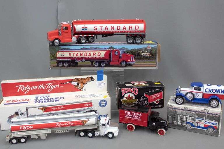 Collection of toy trucks, includes Exxon toy tanker truck with real ...