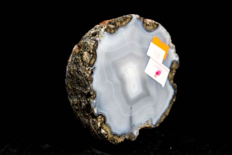 A solid fill Coconut Geode with a blue-gray, banded Chalcedony filled ...