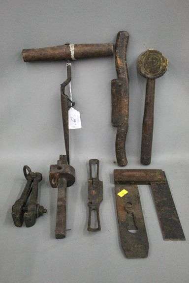 Antique carpenter tools. Items include hand vise, carpenters try square ...