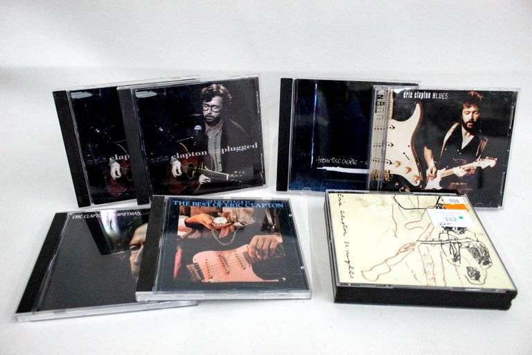 Collection of Eric Clapton CDs. Items include "The Best of Eric Clapton ...