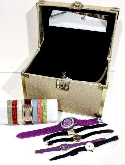Collection of ladies watches in a gold jewelry box with lock and key ...