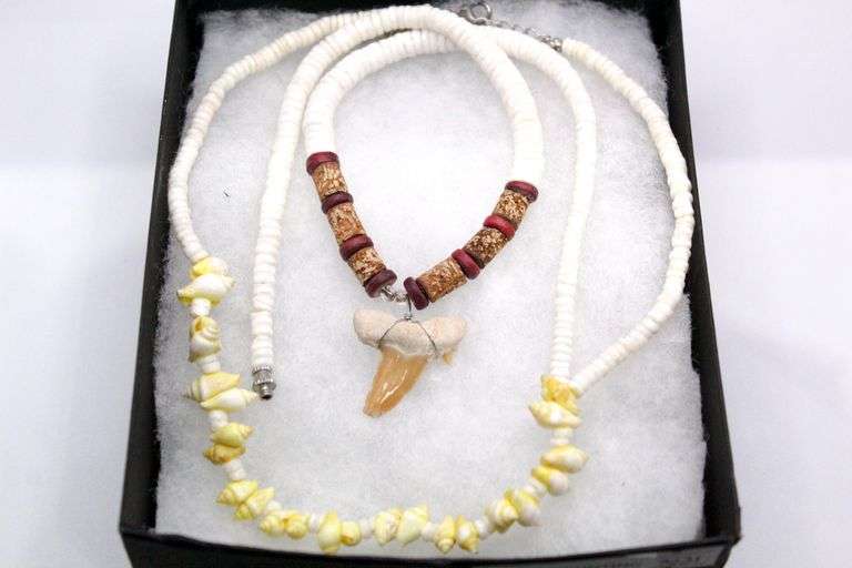 Necklaces of Puka shells, shark's tooth and tiny conch shells. Two ...